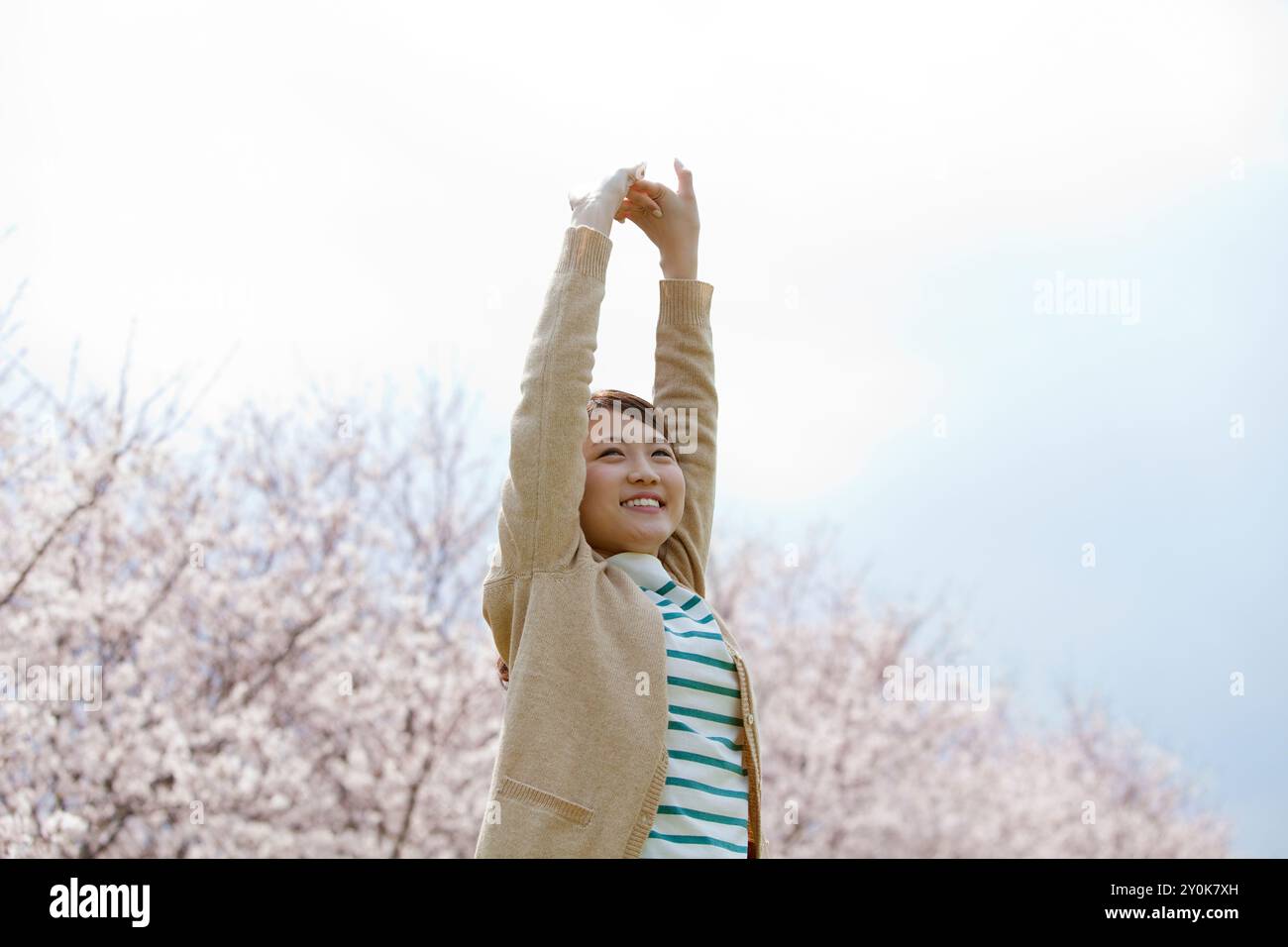 Woman stretching with smile Stock Photo - Alamy