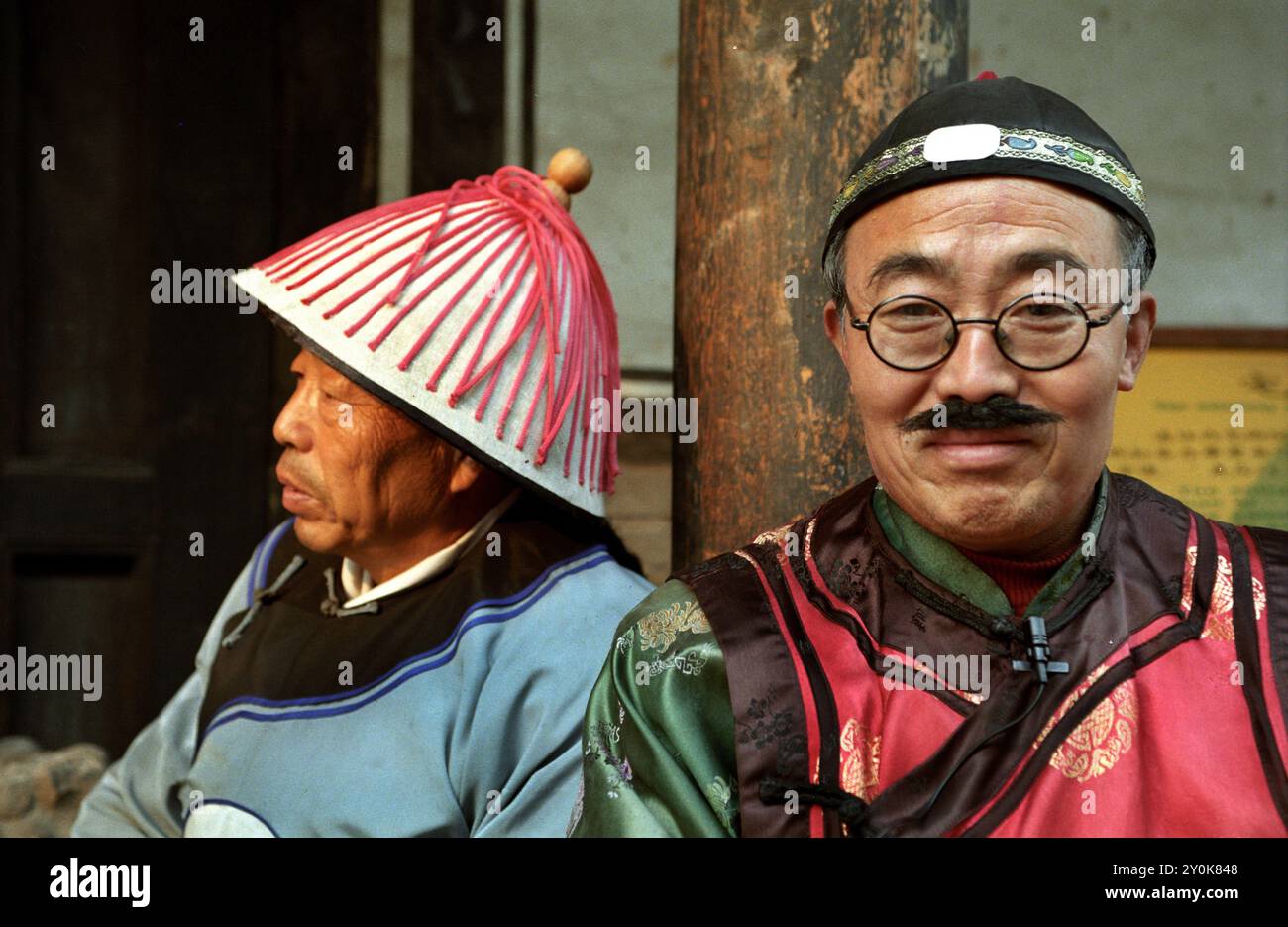 Chinese men in traditional clothes in the beautiful old city of PingYao ...