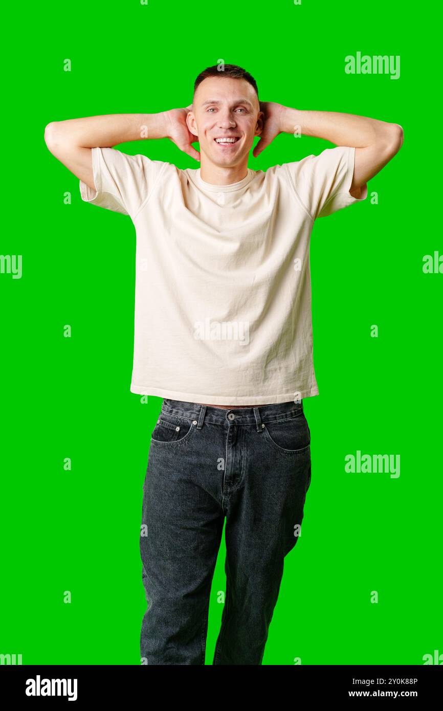 Man Reacting in Surprise With Hands on Head Against a Bright Green ...
