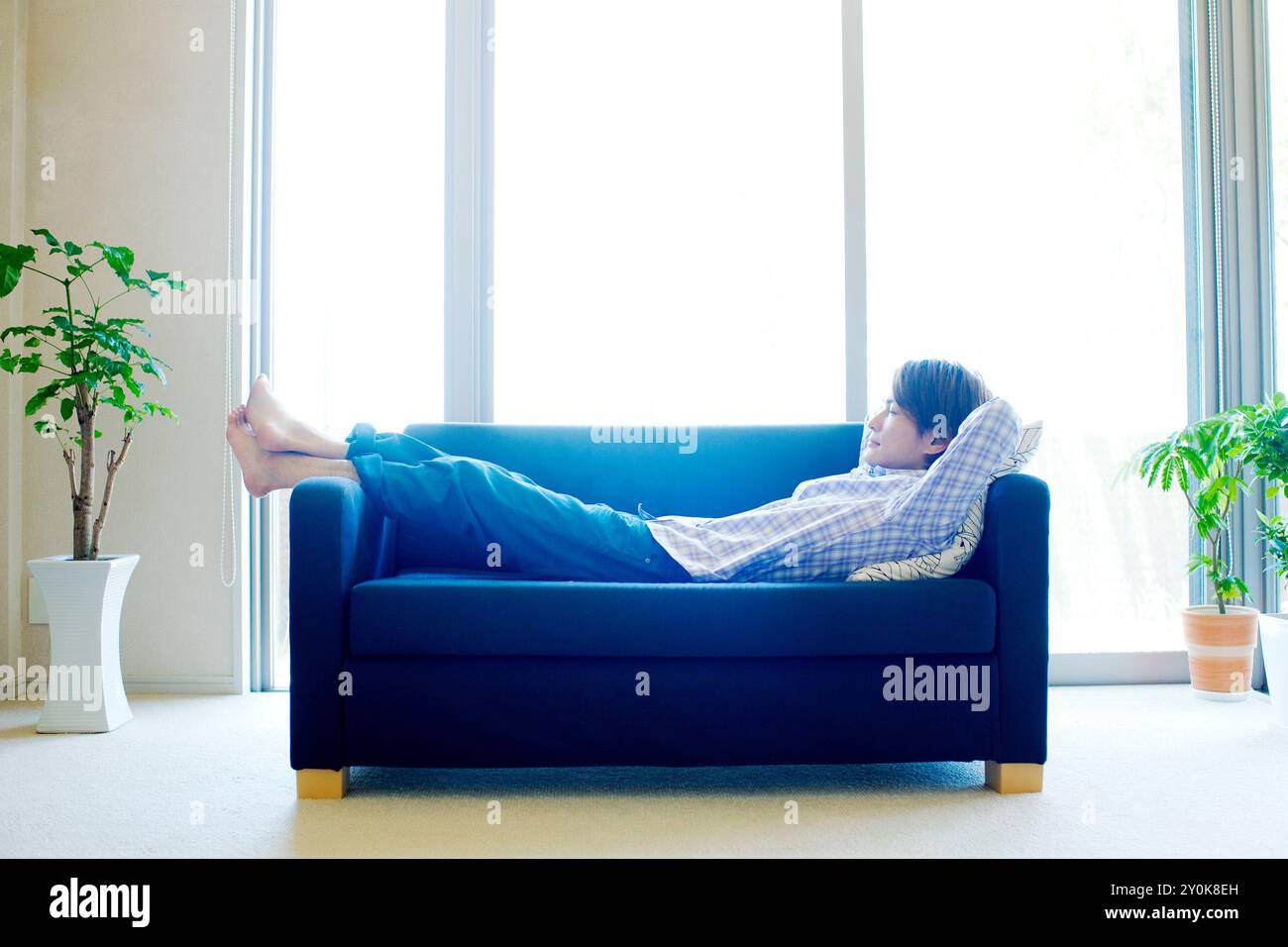 Adult lying on couch hi-res stock photography and images - Alamy