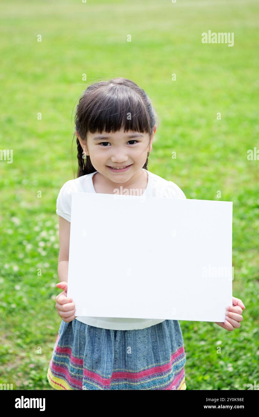 Girl holding a message board Stock Photo - Alamy