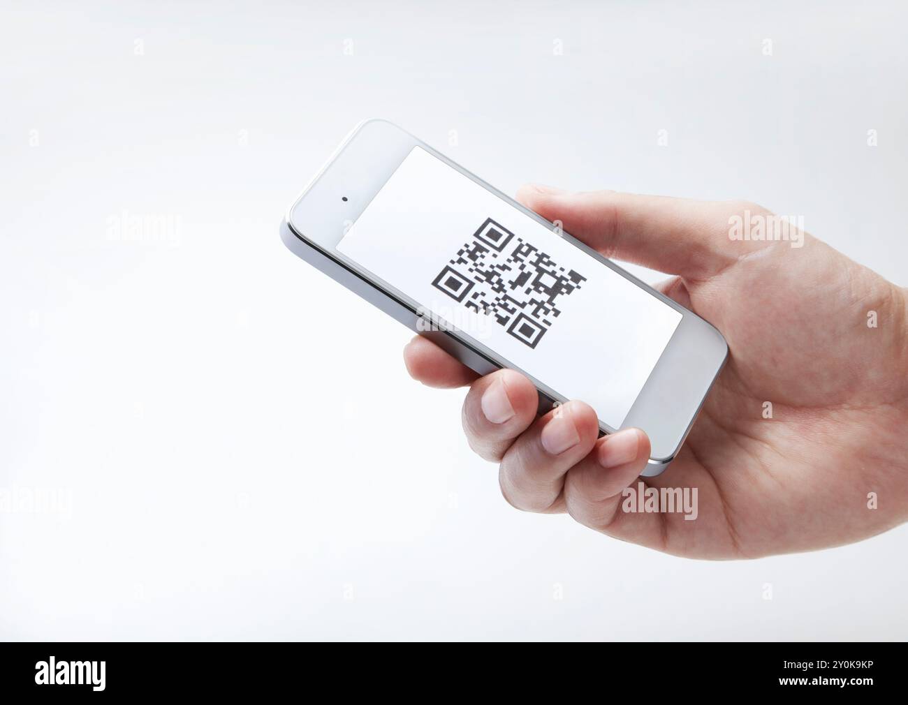 Smartphone reading a QR code Stock Photo - Alamy