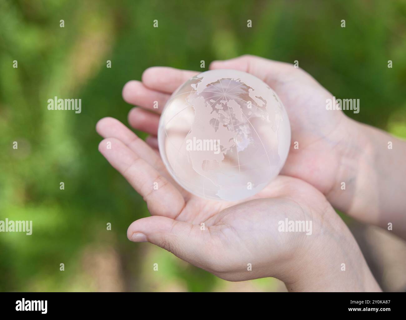 Hand holding a globe Stock Photo - Alamy