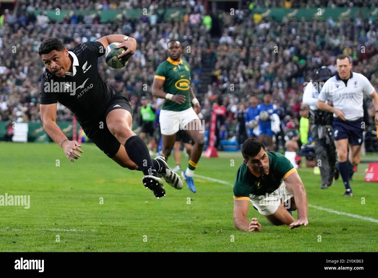New Zealand's Caleb Clarke runs to score a try during a rugby ...