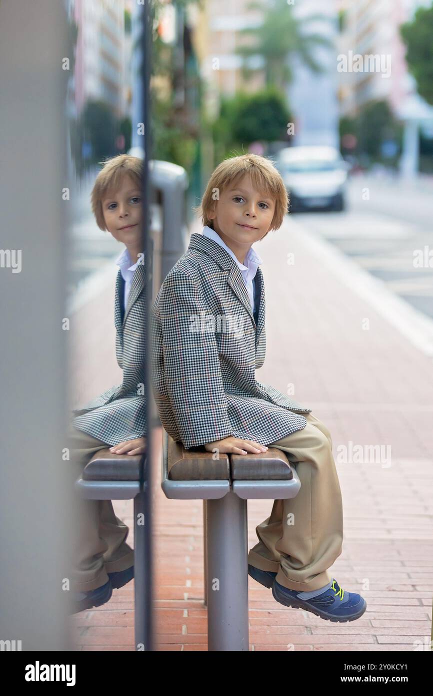Beautiful fashion little boy, child in suit and tie, visiting Monaco ...