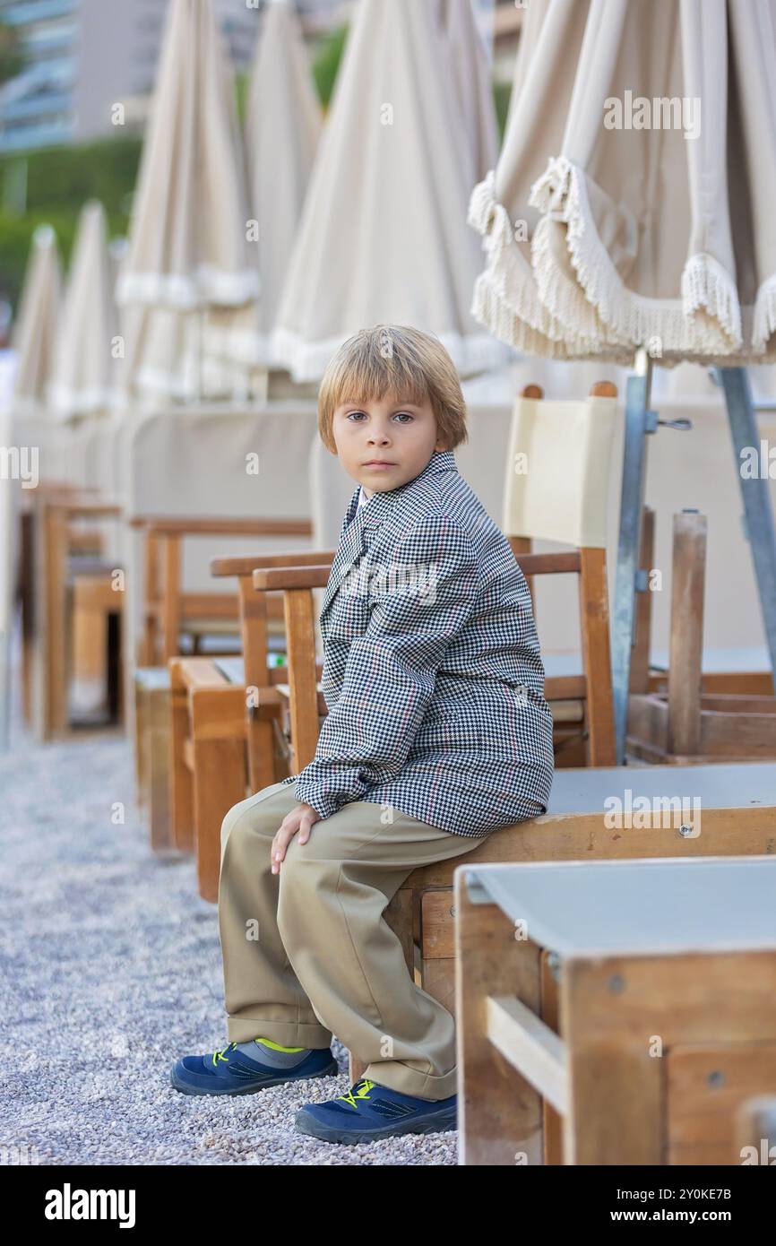 Beautiful fashion little boy, child in suit and tie, visiting Monaco ...