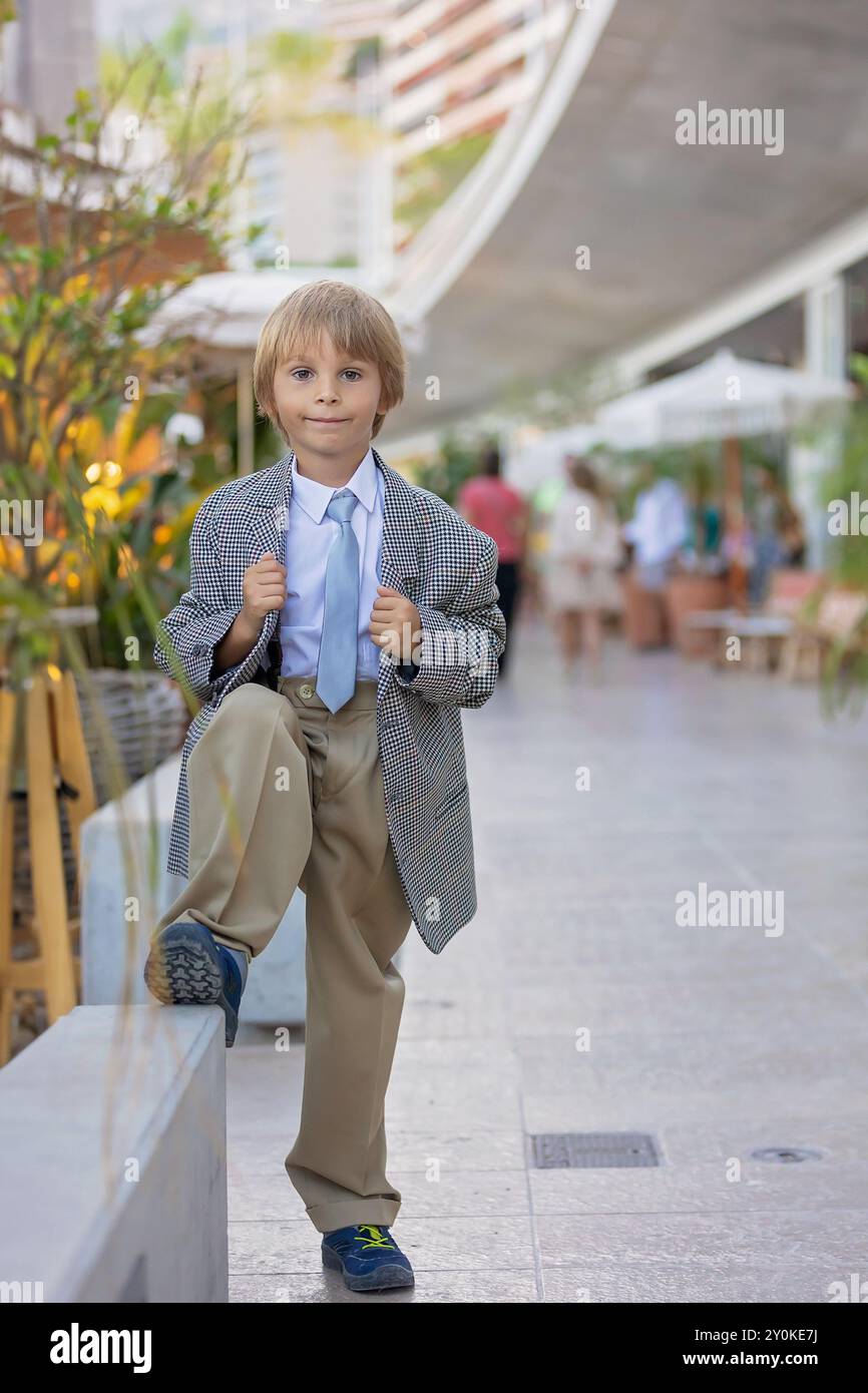 Beautiful fashion little boy, child in suit and tie, visiting Monaco ...