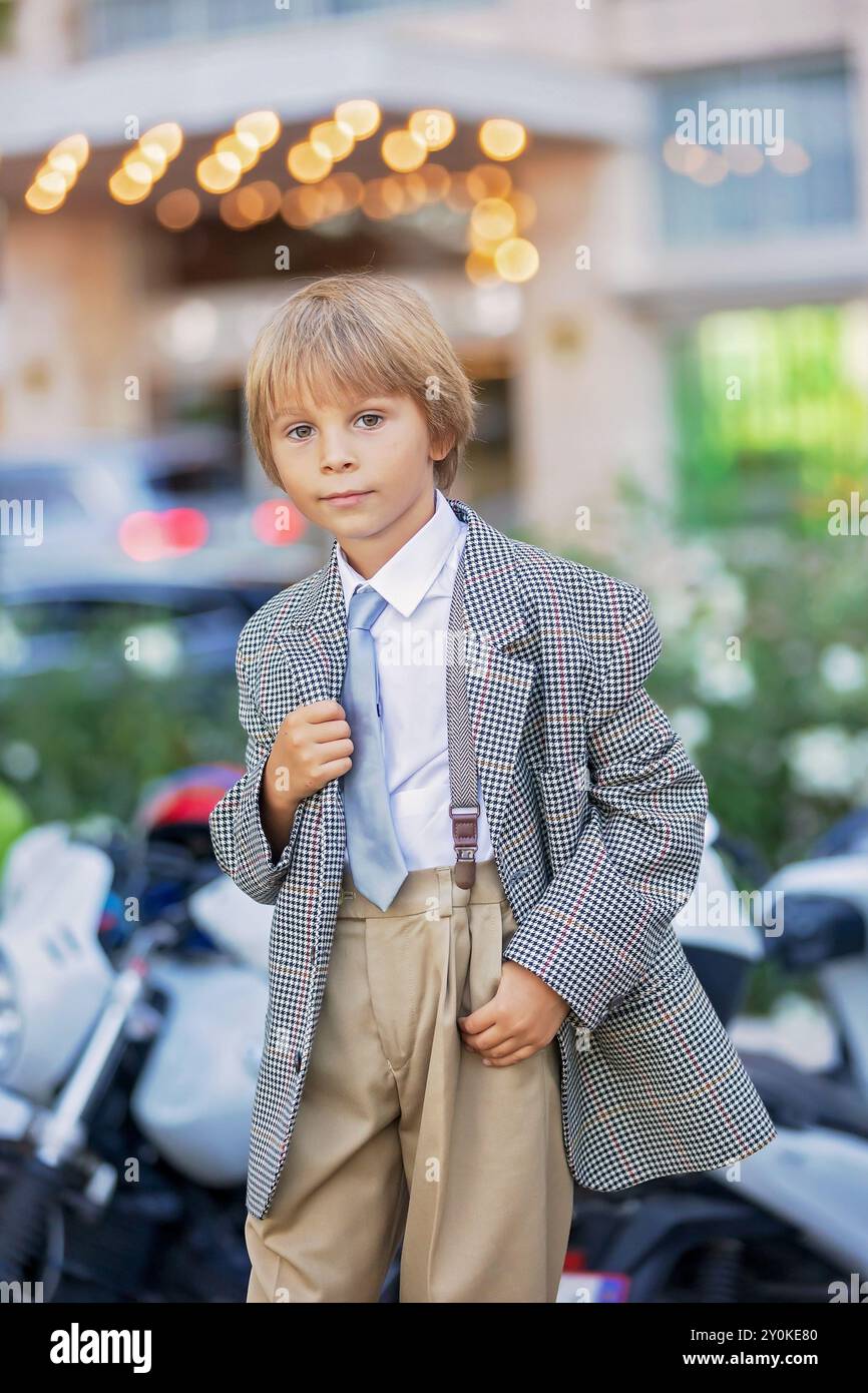 Beautiful fashion little boy, child in suit and tie, visiting Monaco ...