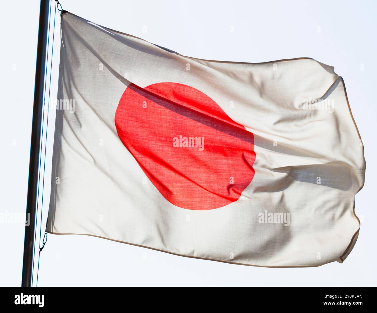 Japan national flag fluttering Stock Photo - Alamy