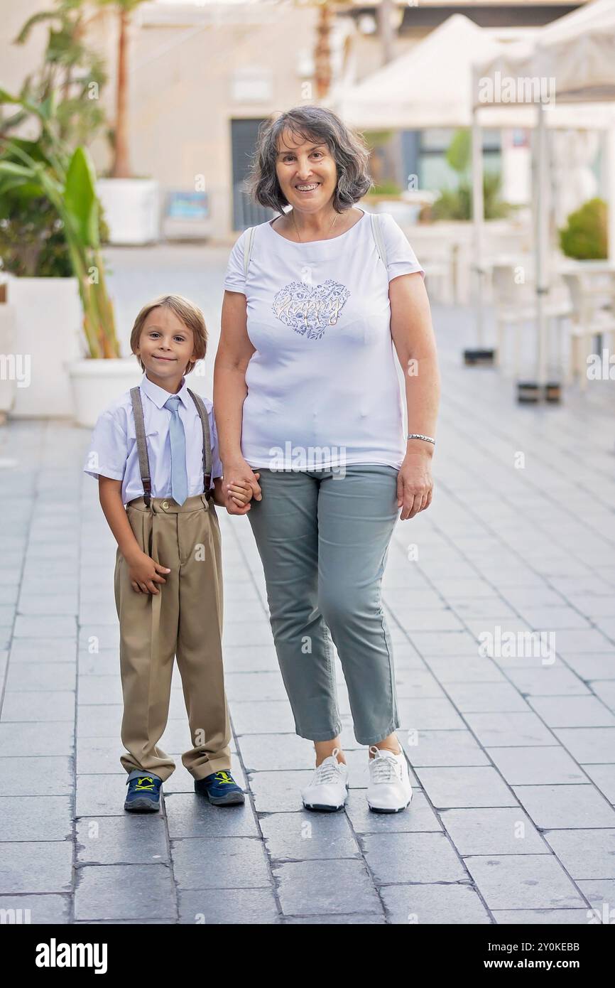 Beautiful fashion little boy, child in suit and tie, visiting Monaco ...