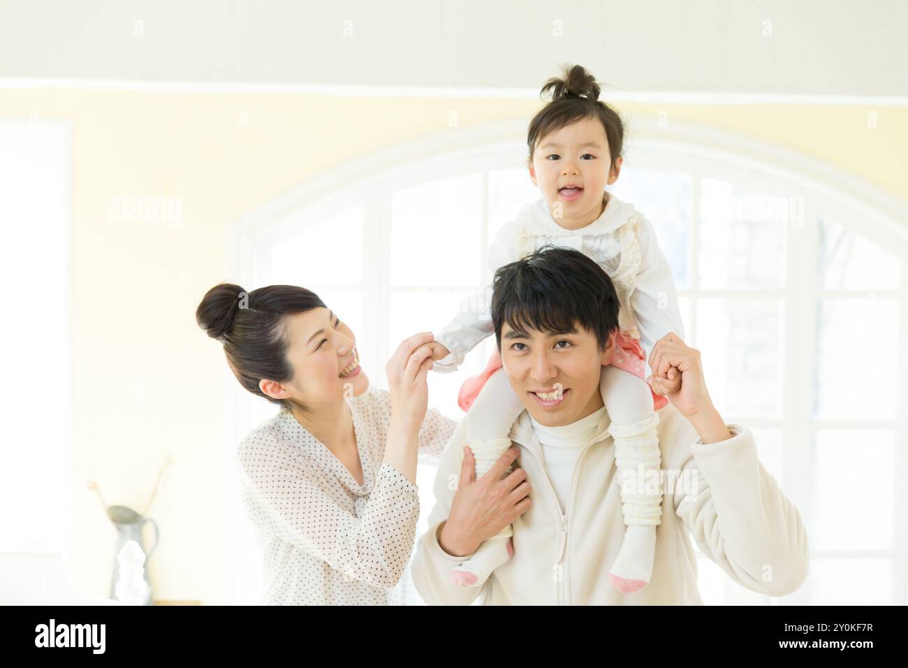 Three person family Stock Photo - Alamy