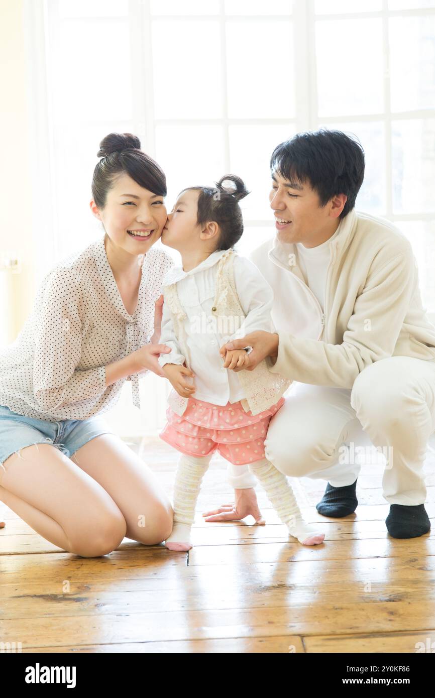 Three person family Stock Photo - Alamy