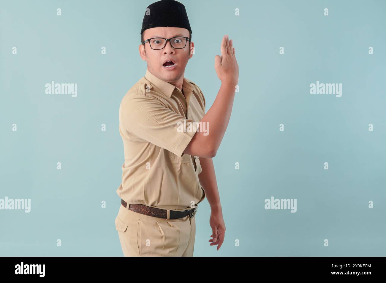 Frustrated government worker man wearing khaki uniform doing slapping ...