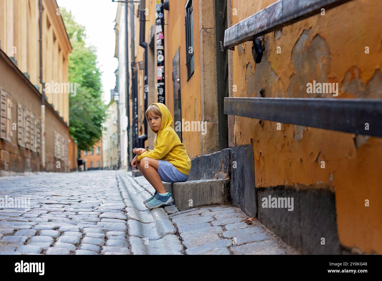 Young preschool child, visiting city of Stockholm with his family ...