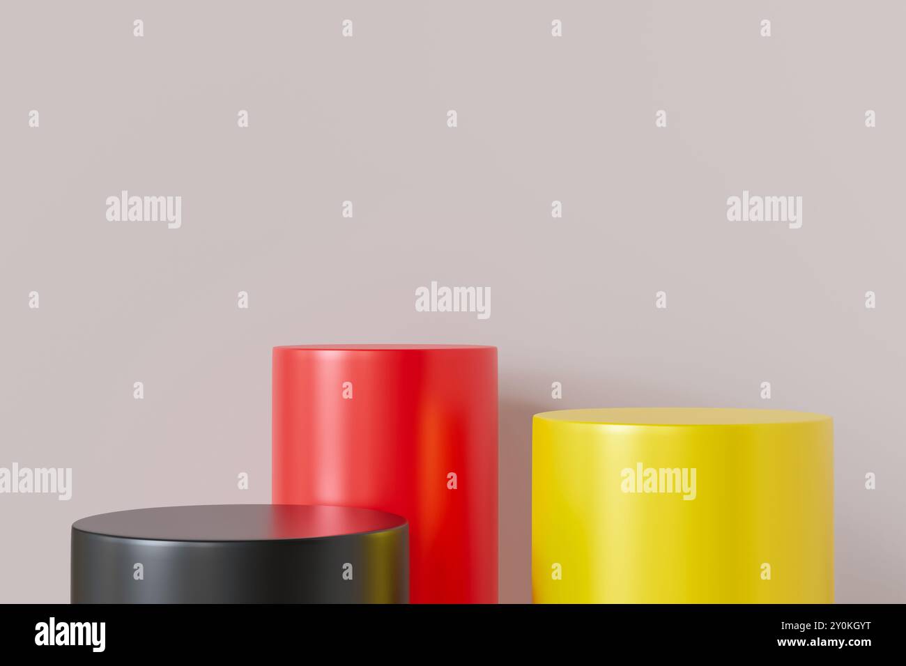 Three cylindrical podiums in the bold colors of the German flag: black ...