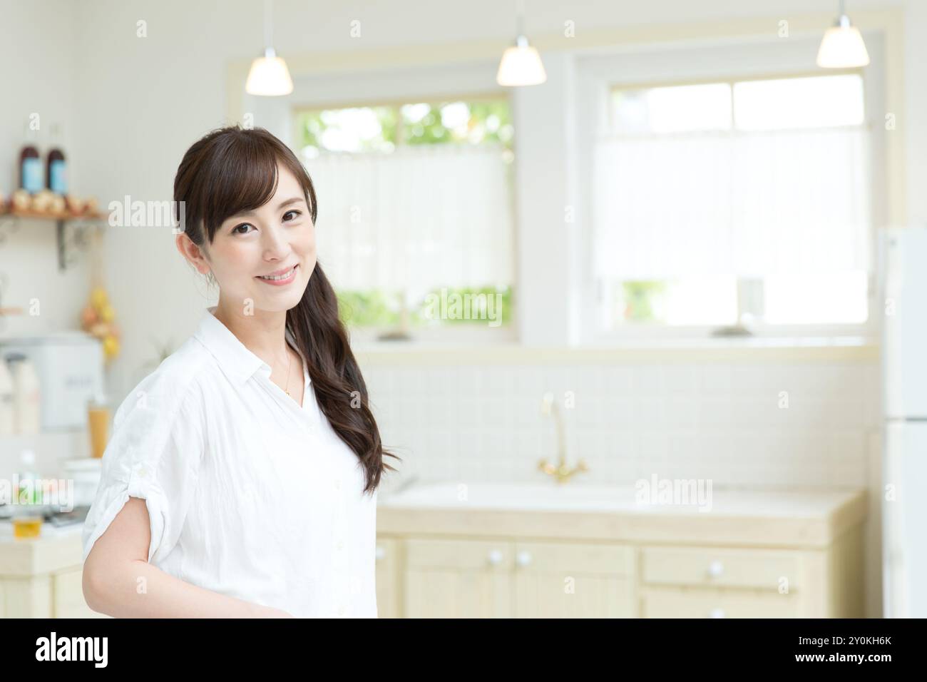 Refreshing woman relaxing in a room Stock Photo - Alamy