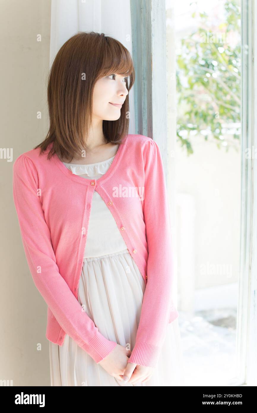 Refreshing woman relaxing in a room Stock Photo - Alamy