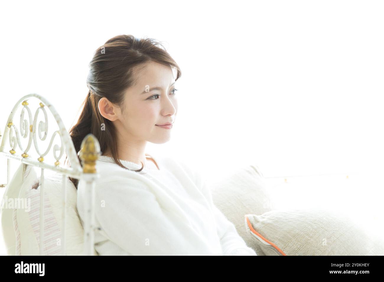 Refreshing woman relaxing in a room Stock Photo - Alamy