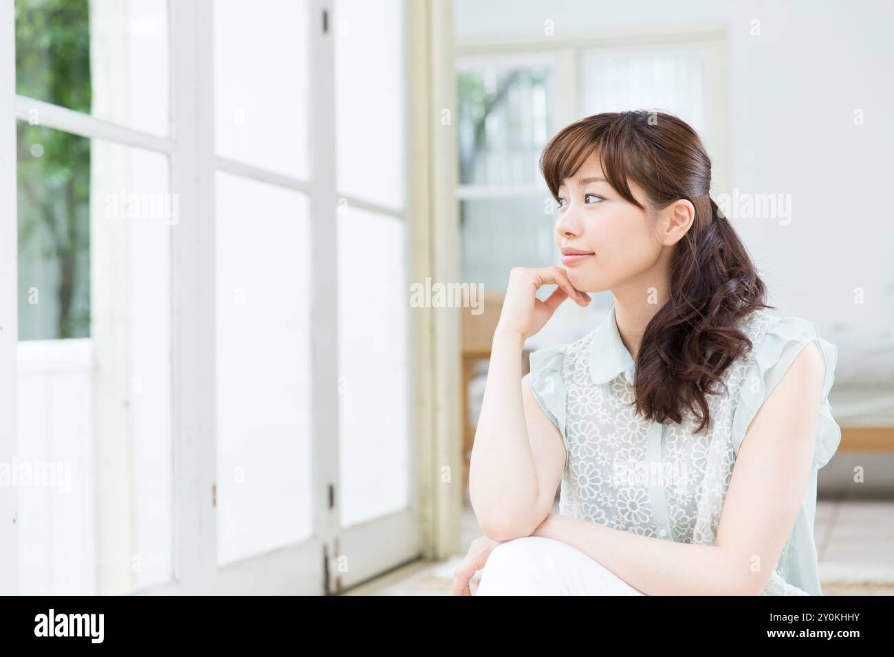 Refreshing woman relaxing in a room Stock Photo - Alamy