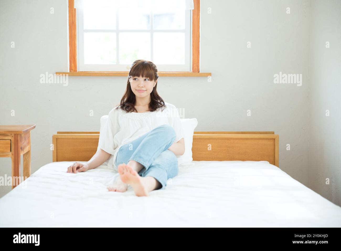 Refreshing woman relaxing in a room Stock Photo - Alamy
