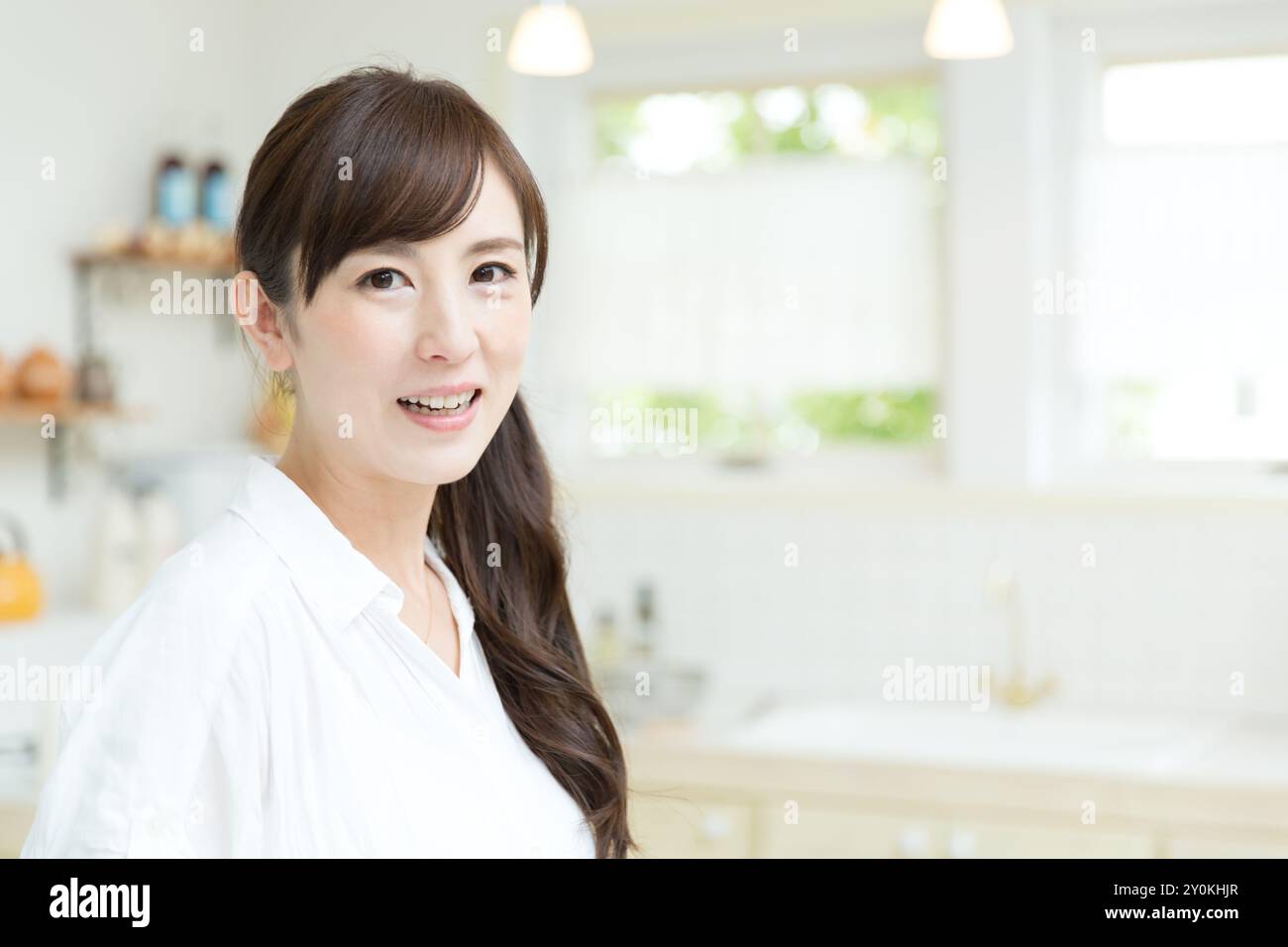 Refreshing woman relaxing in a room Stock Photo - Alamy