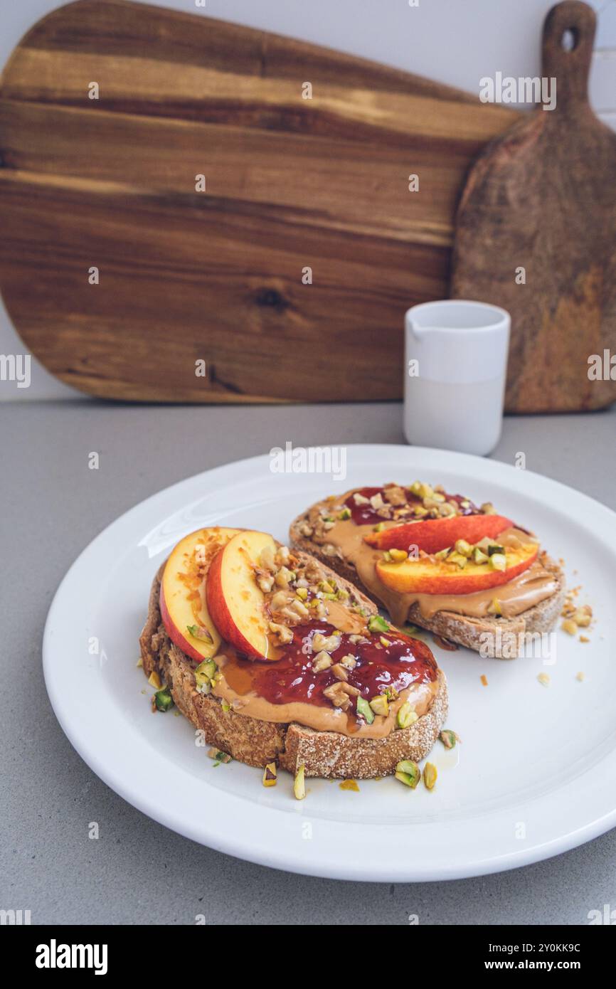 Peanut butter and jam jam with peach and nuts, kitchen background ...