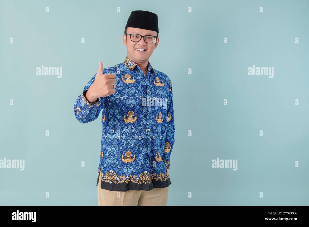Handsome Indonesian government worker man wearing blue batik uniform ...