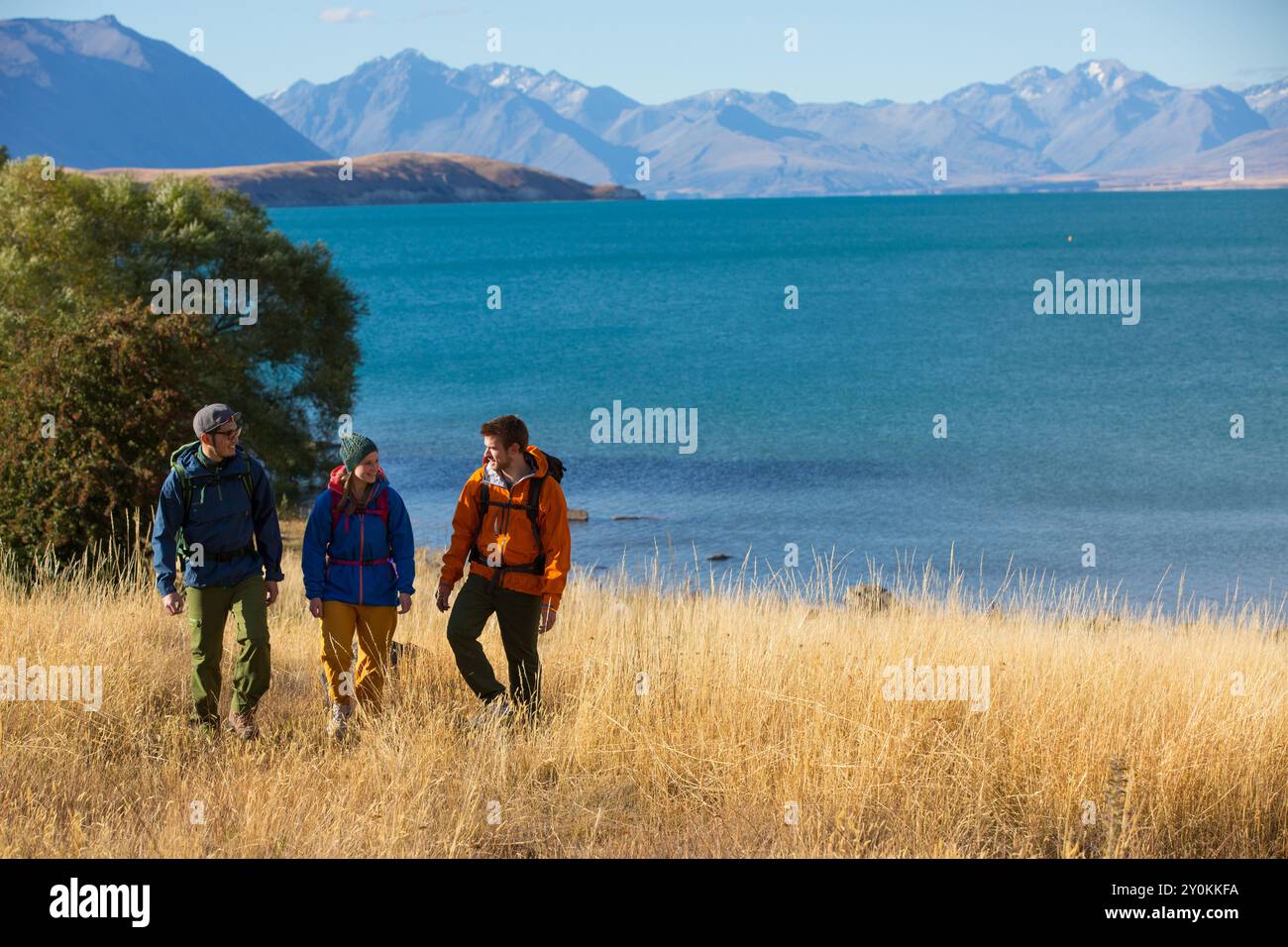 Japanese man in his thirties trekking with foreign couple Stock Photo ...