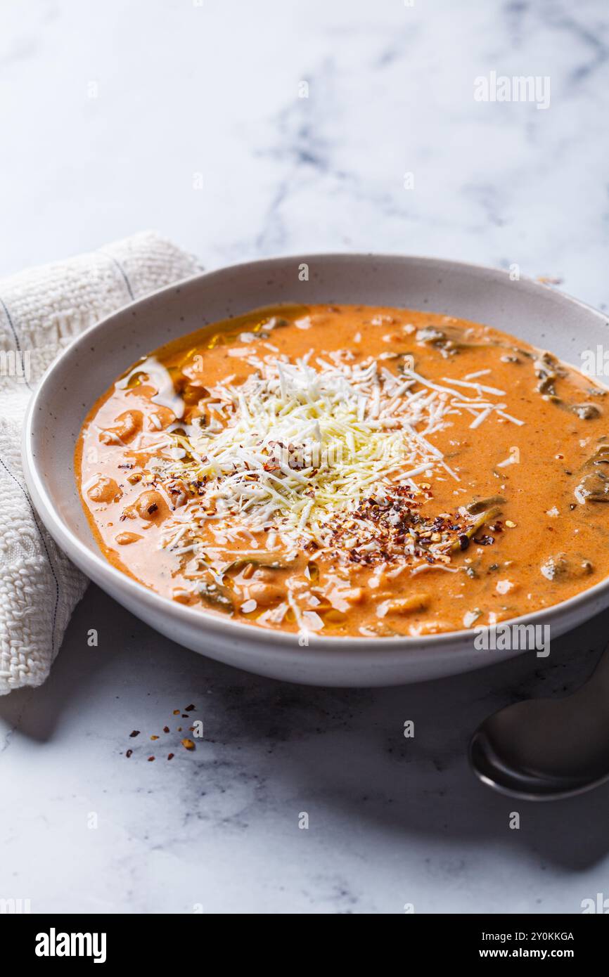 Creamy tomato white bean stew with spinach and cheese Stock Photo - Alamy