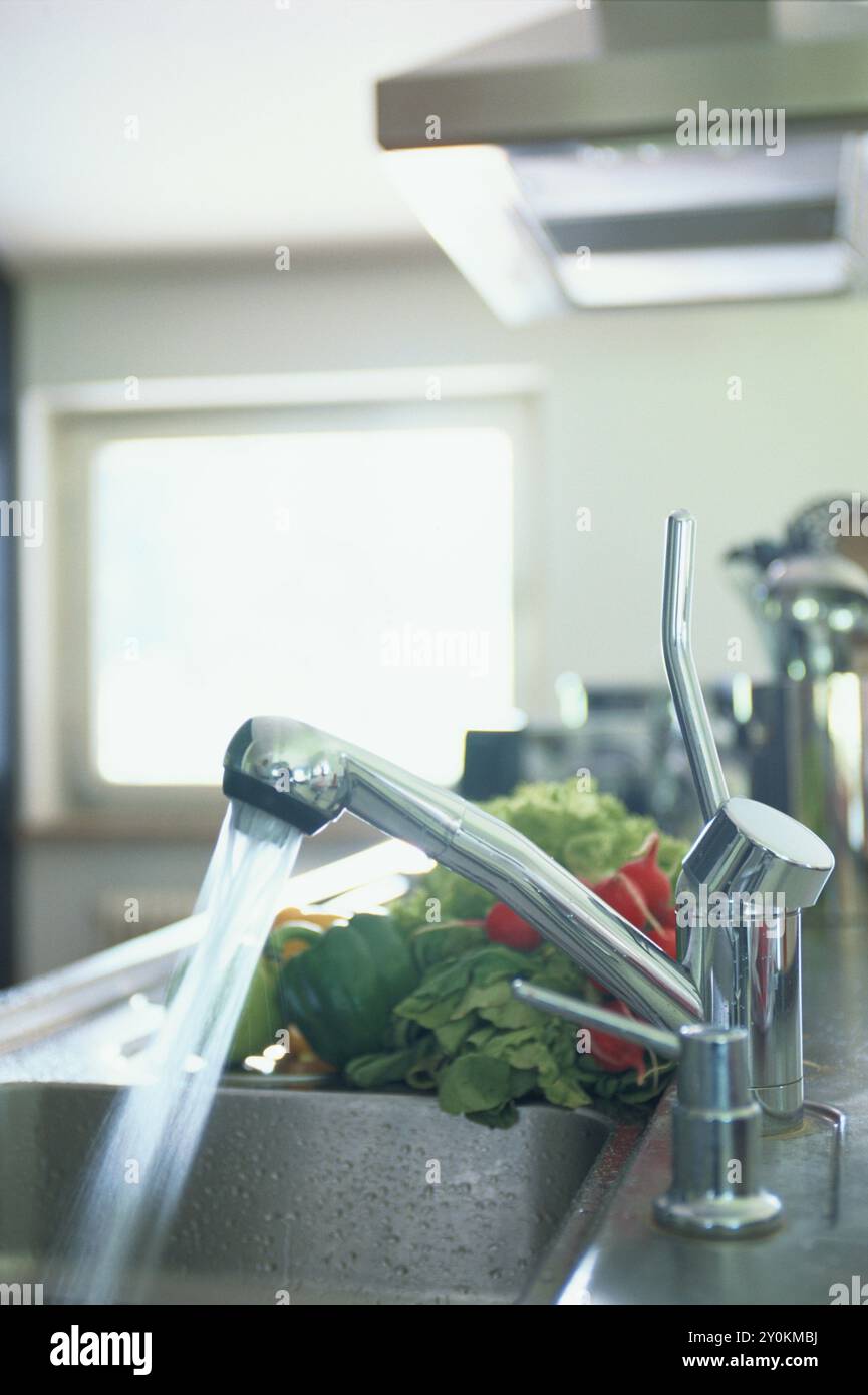 Water flowing from the faucet Stock Photo - Alamy
