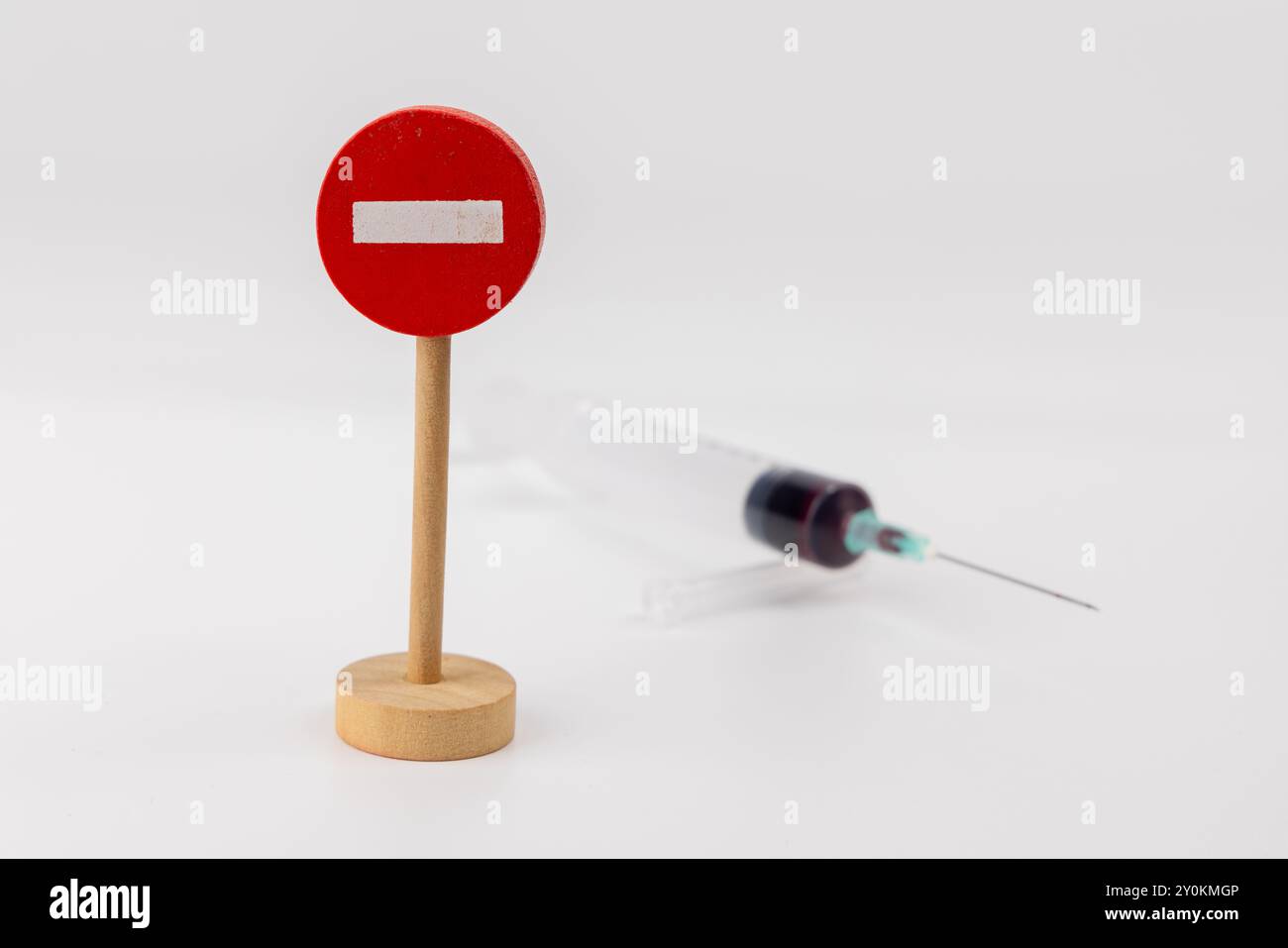 Close-up of a wooden prohibition sign, centrally positioned, with a ...