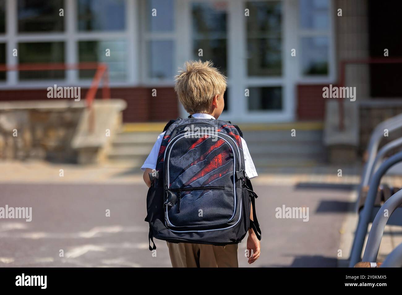 Cute first grade school child, going to school. First day at school for ...