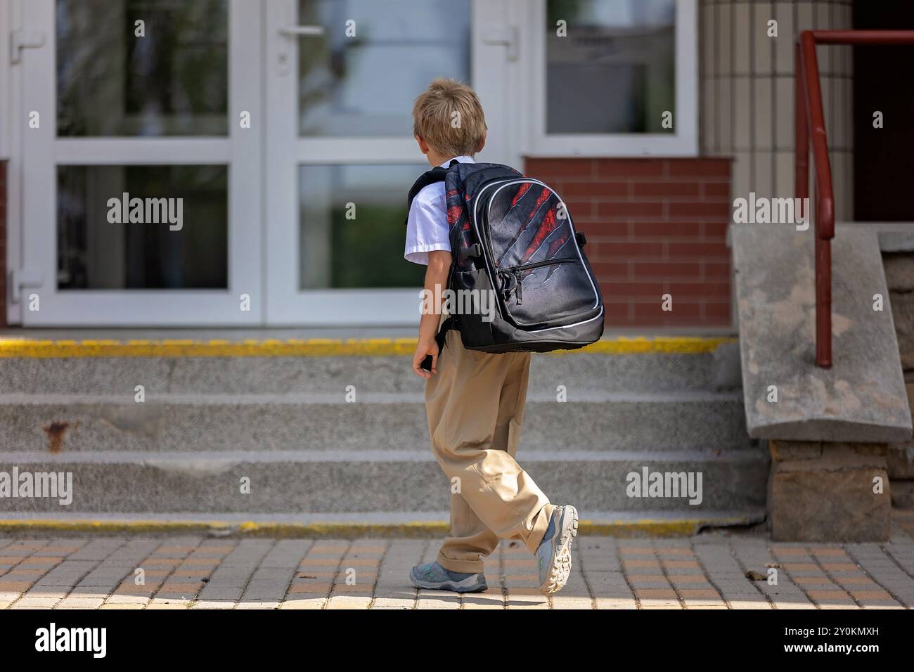Cute first grade school child, going to school. First day at school for ...