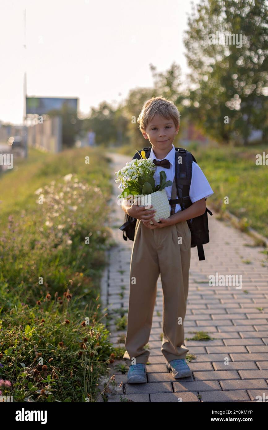 Cute first grade school child, going to school. First day at school for ...