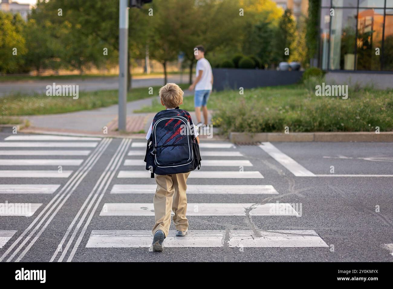 Cute first grade school child, going to school. First day at school for ...