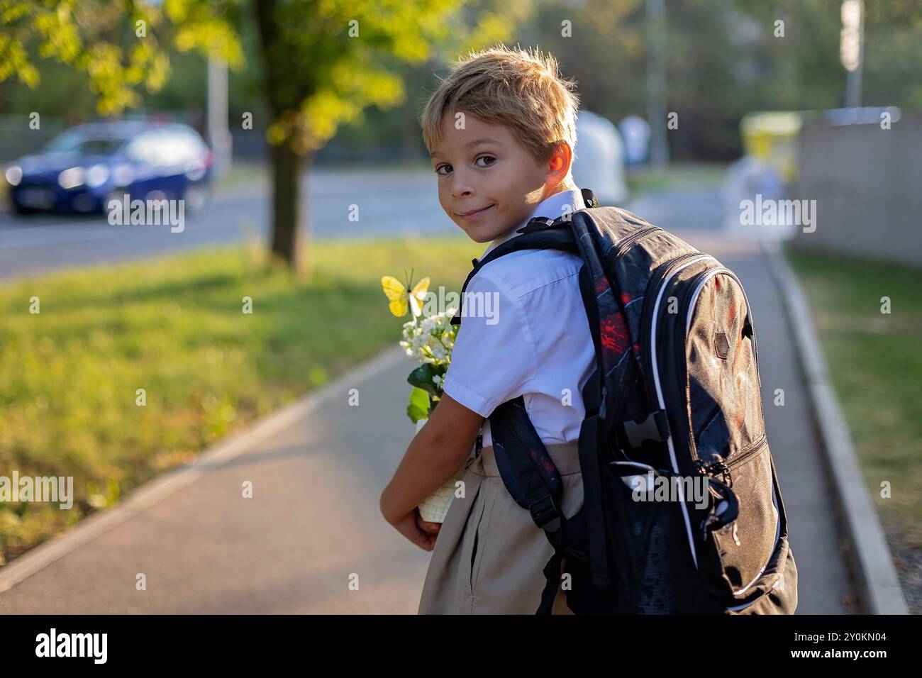 Cute first grade school child, going to school. First day at school for ...