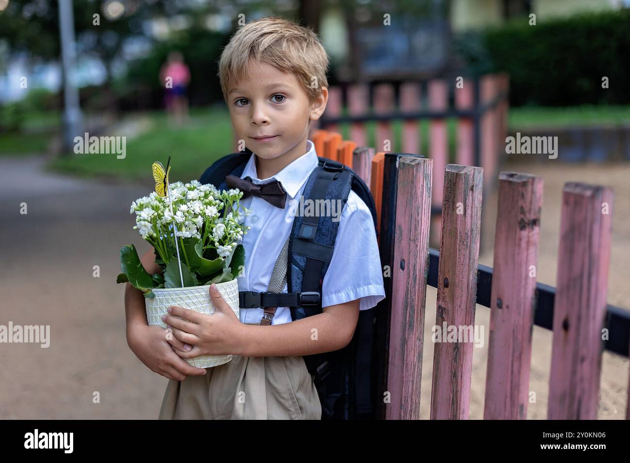 Cute first grade school child, going to school. First day at school for ...