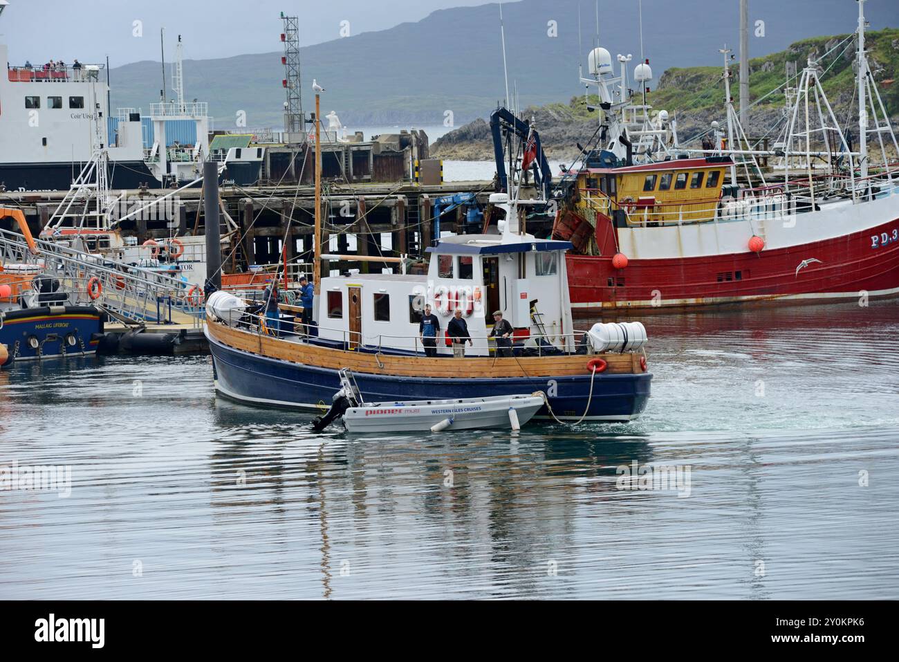 A Western Isles cruises boat leaving the harbour at Mallaig, Scotland ...