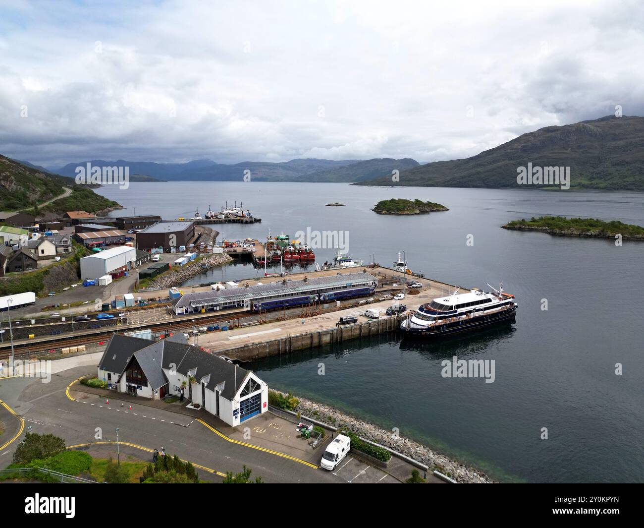Aerial drone view of Kyle of Lochalsh railway station and harbour ...