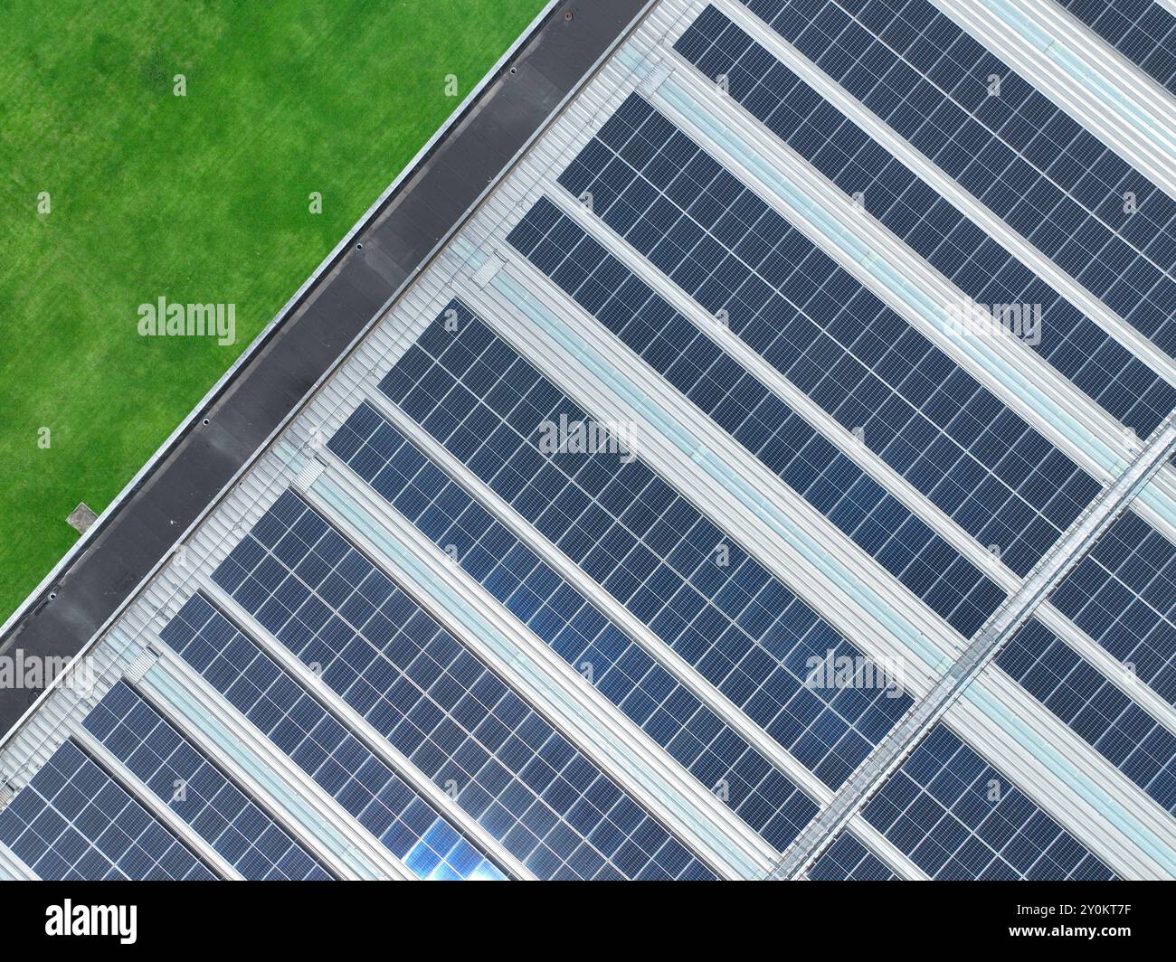 Solar energy for factory and warehouse building. Solar panels on roof ...