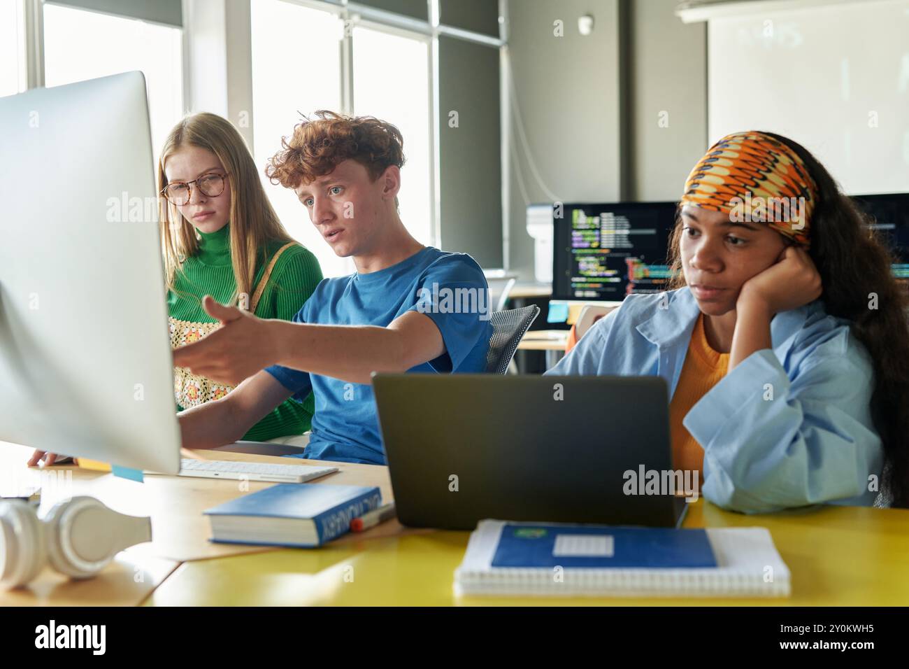 Group of People Sitting at Desk with Computers IT Class in School in ...