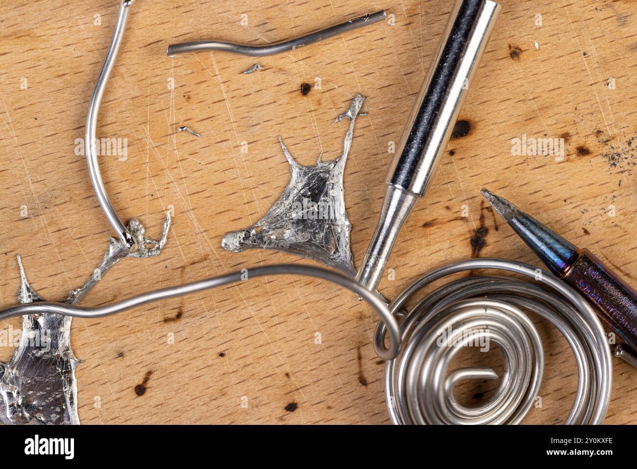 thin and soft solder and soldering iron tips, twisted as a spring ...