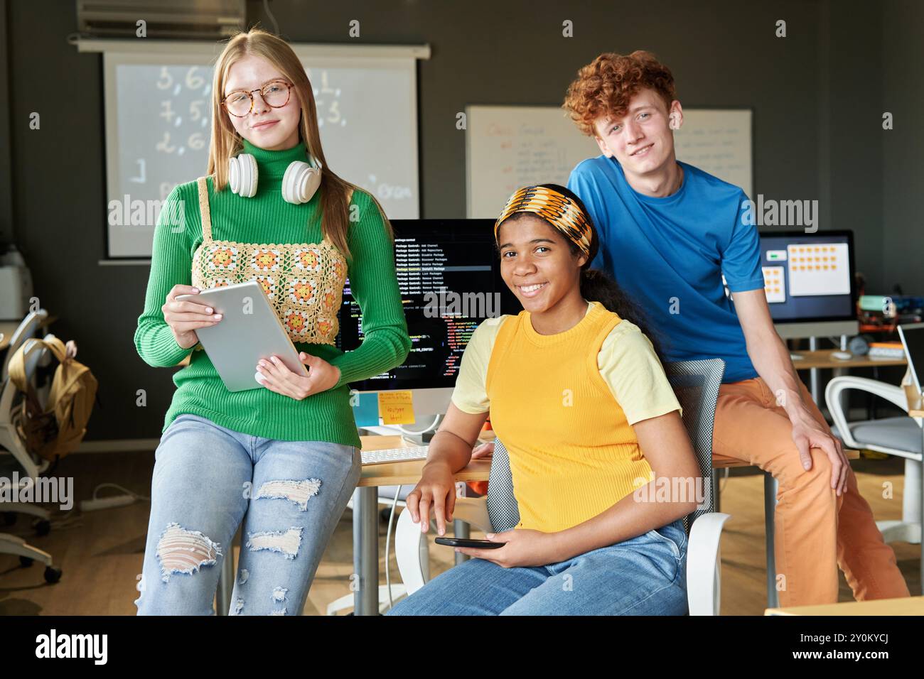 Group of People Smiling in IT Classroom Stock Photo - Alamy