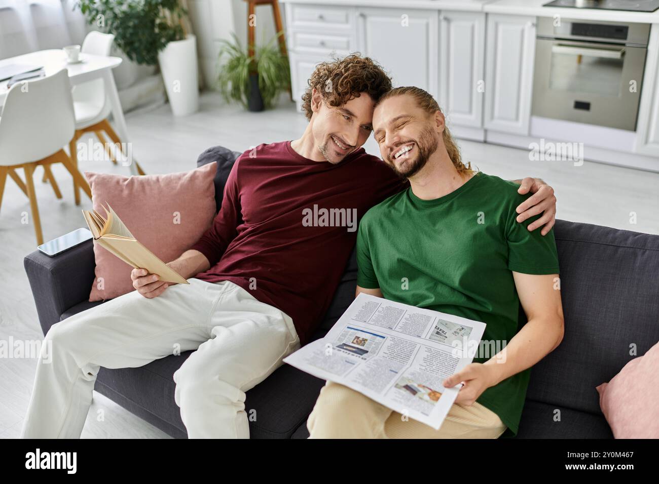 A loving couple shares laughter while enjoying their cozy home Stock ...