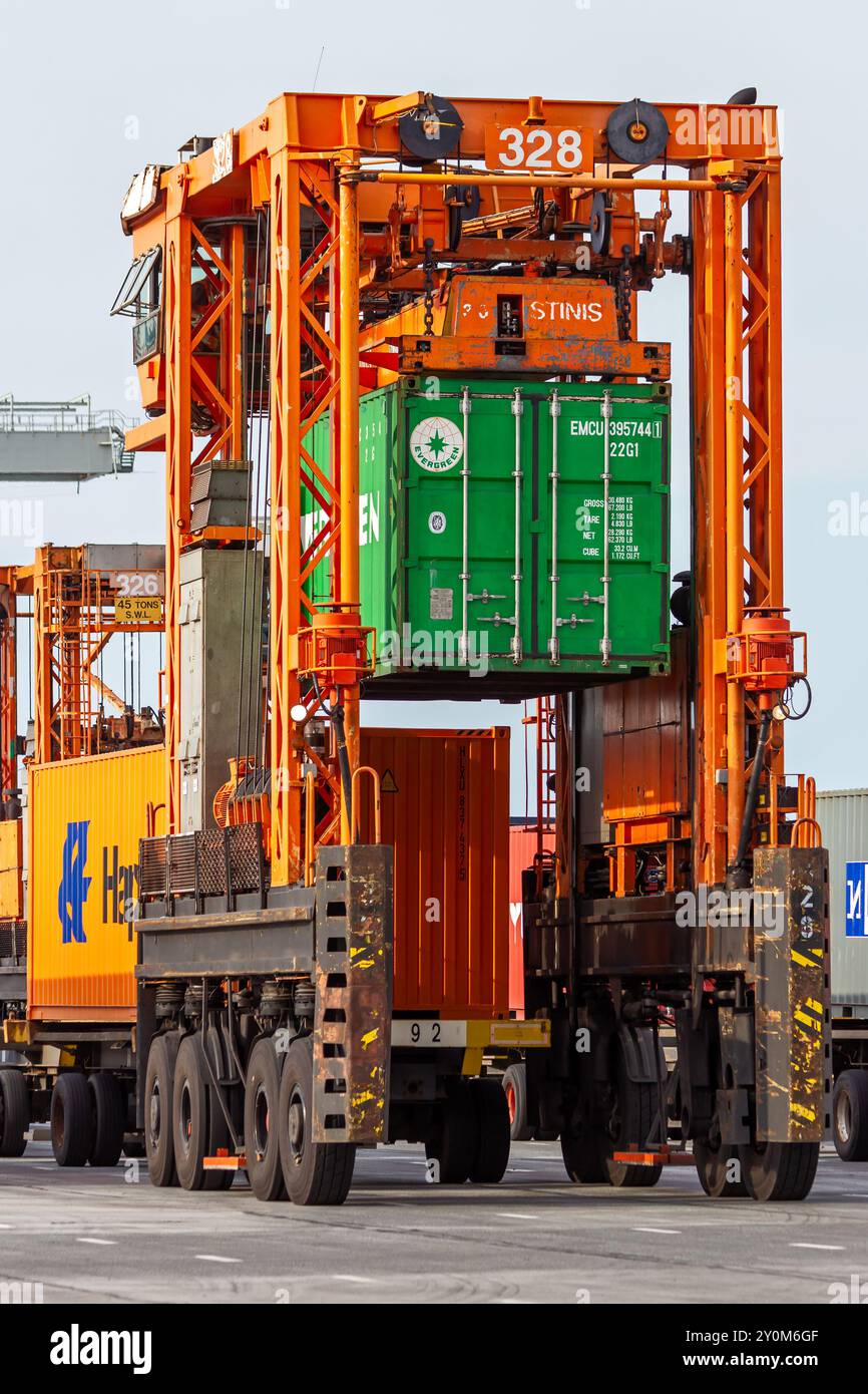 Straddle carrier moving containers in a container terminal. Port of ...