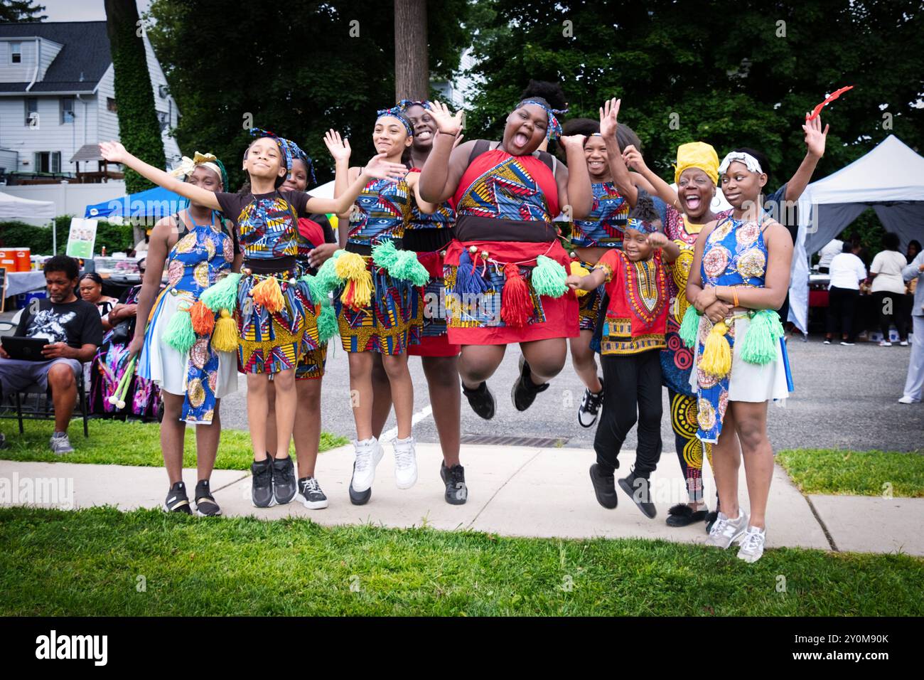 Girls from the Revelators Dance Troupe pose with their leader (yellow ...