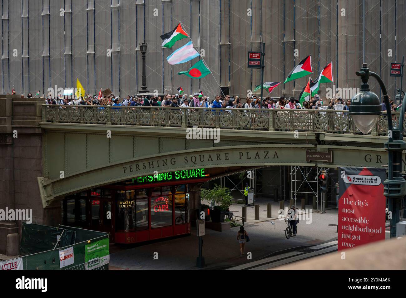 Pro-Palestinians holding flags march over Pershing Square Bridge during ...