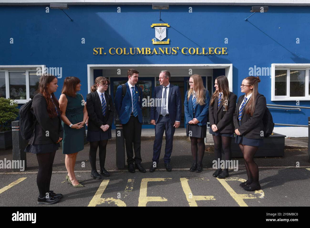 Principal Maria Flynn (2nd left) with students and Education Minister Paul Givan (centre) during ...