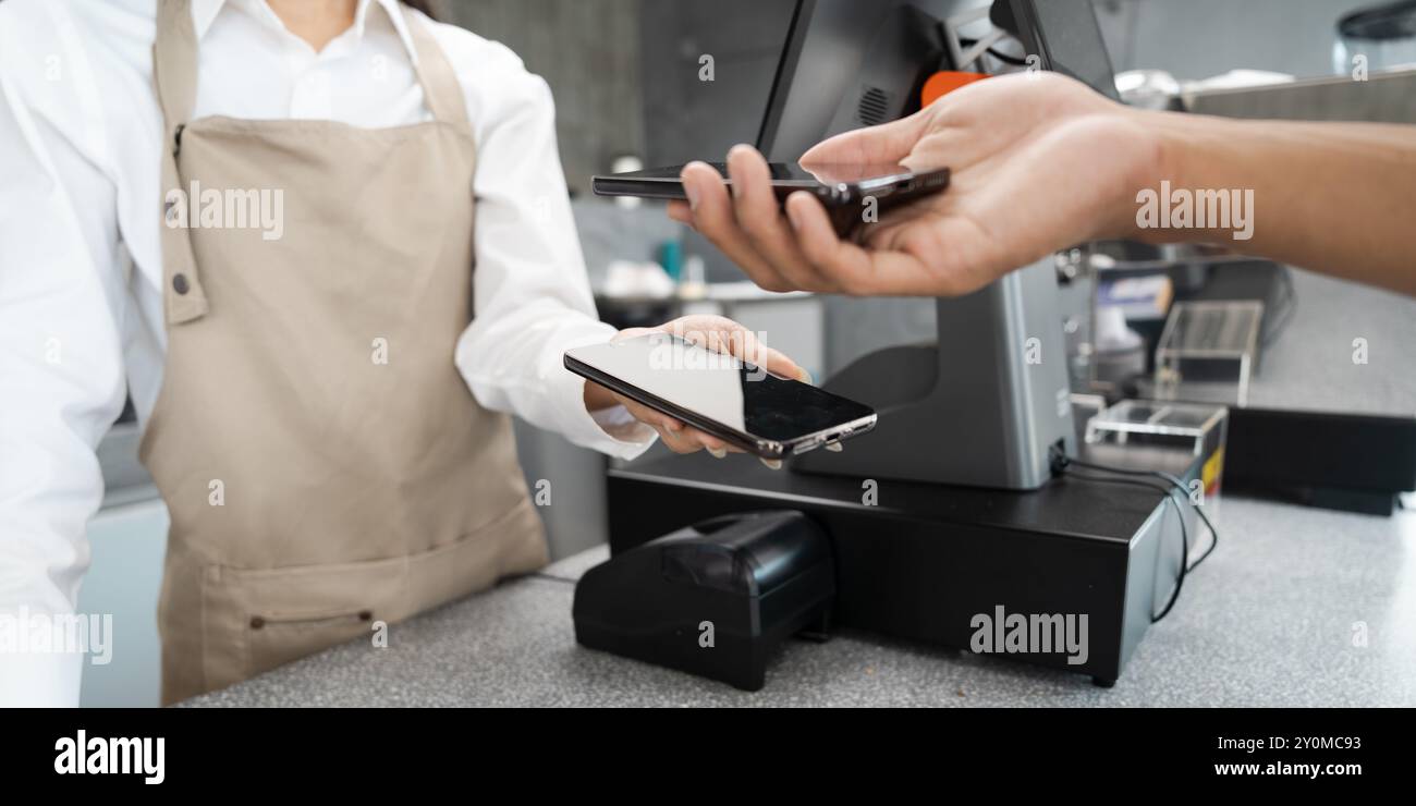 Contactless Mobile Payment at Modern Retail Store Counter with Customer ...