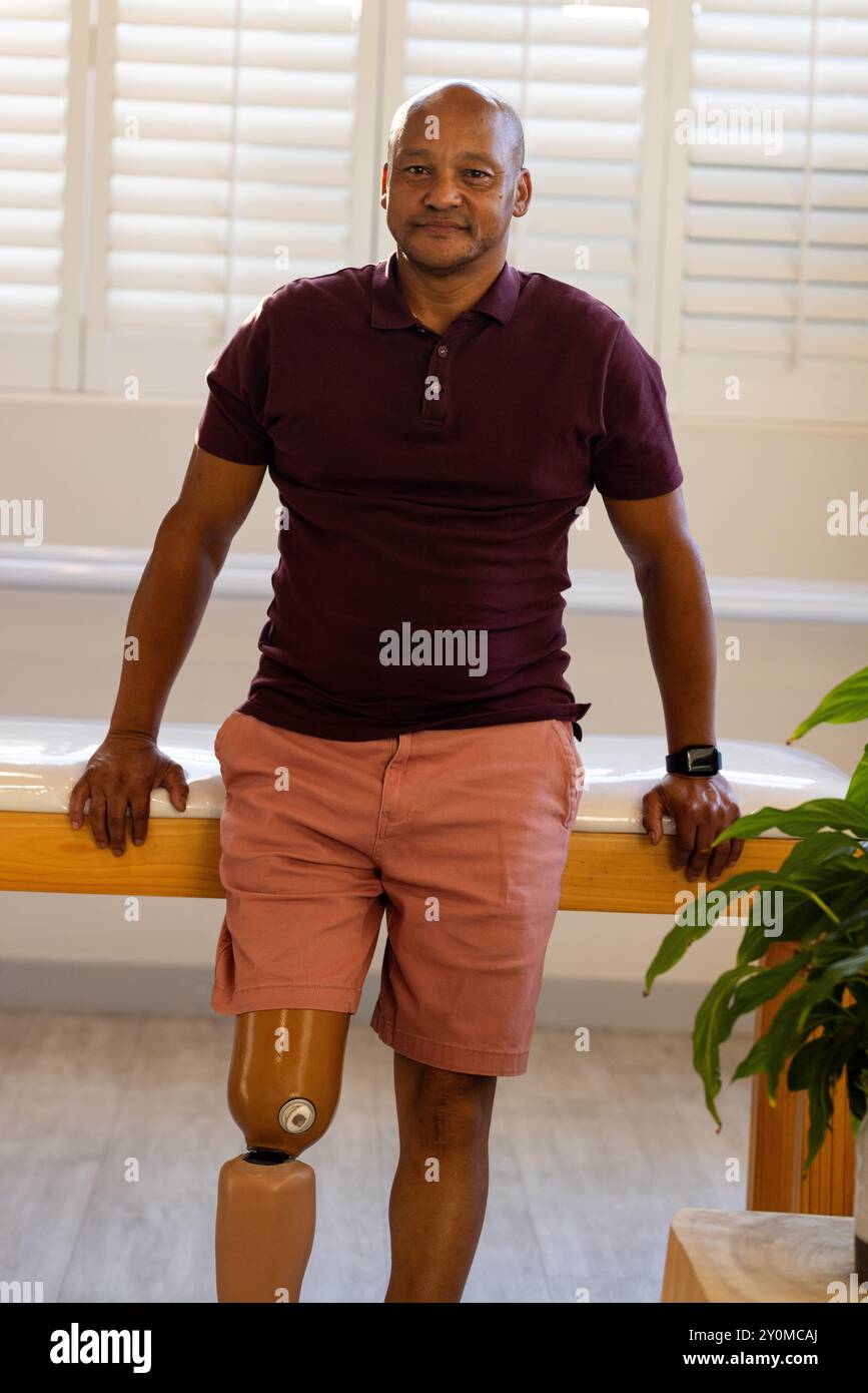 Man with prosthetic leg standing confidently in modern prosthetic ...